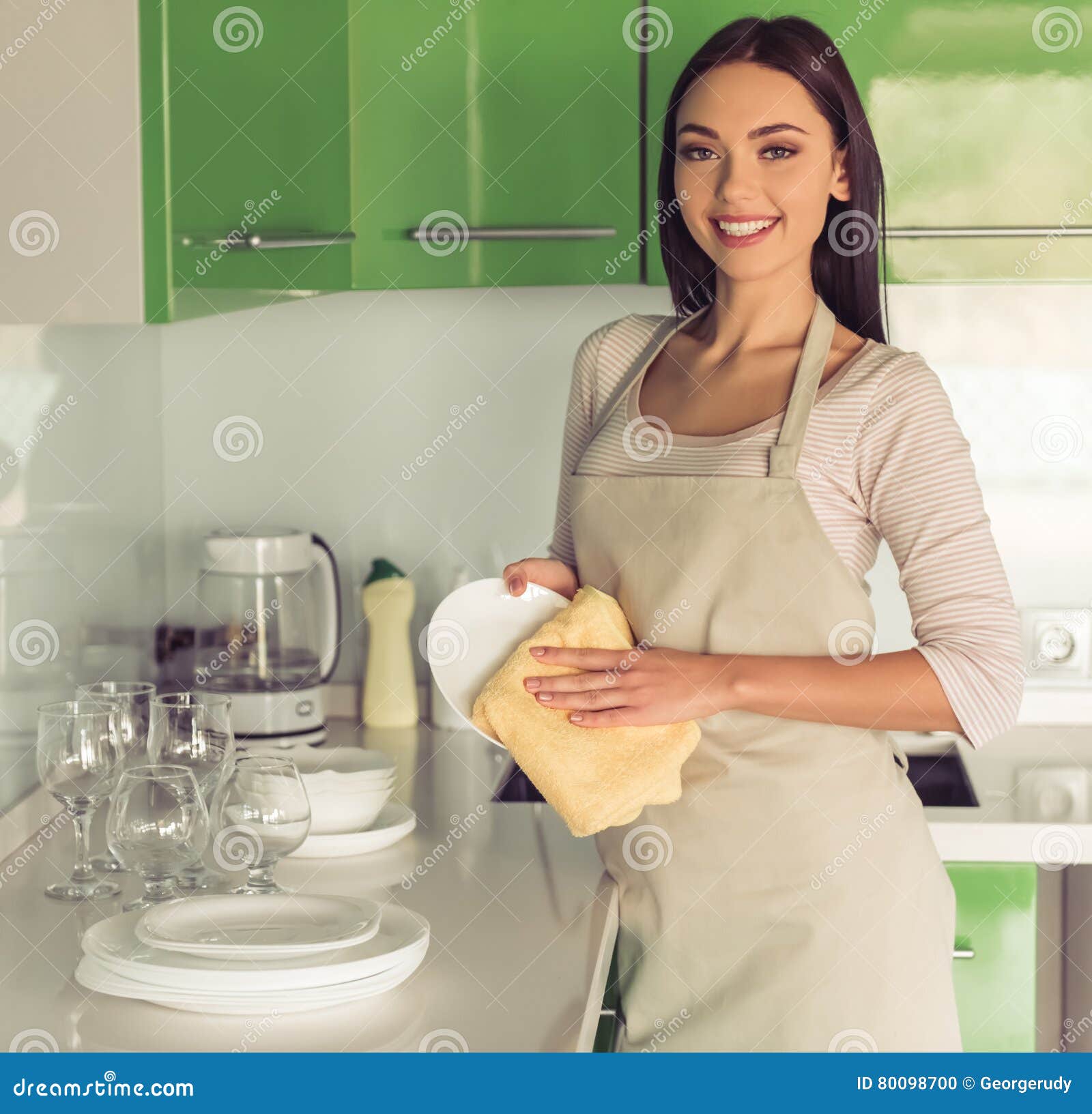 Woman cleaning her kitchen stock photo. Image of faucet - 80098700