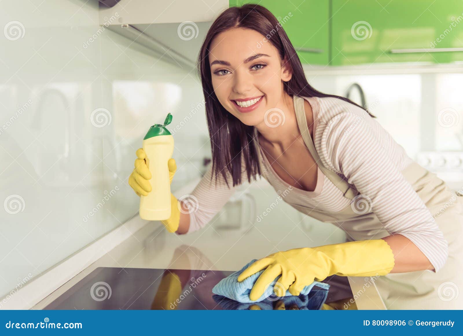 Woman cleaning her kitchen stock photo. Image of home - 80098906