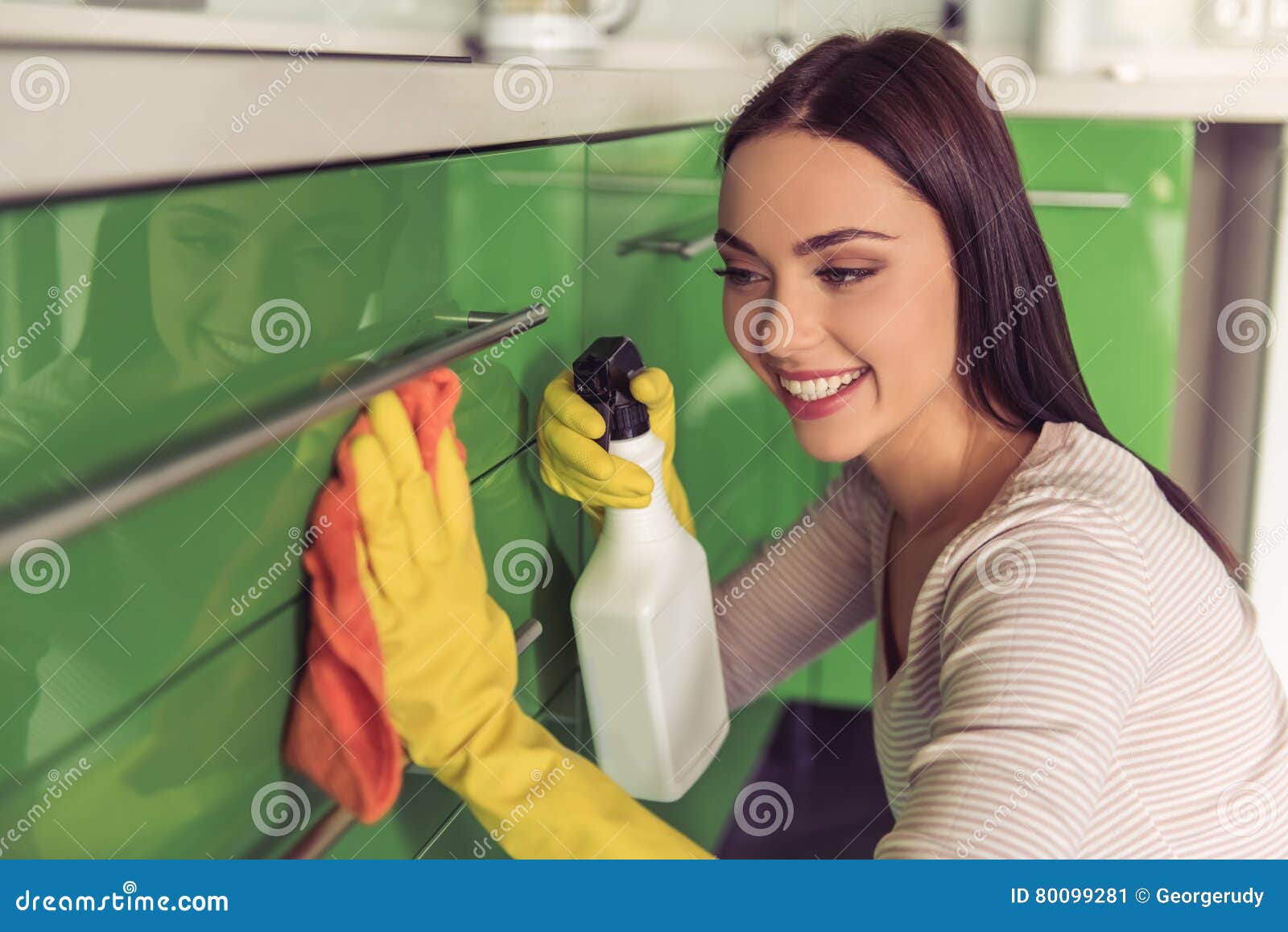 Woman cleaning her kitchen stock image. Image of adult - 80099281