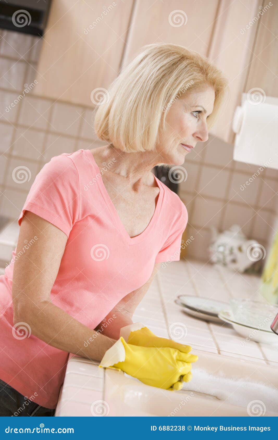 Woman Cleaning Kitchen Counter Stock Photo - Image of sixties, indoors ...