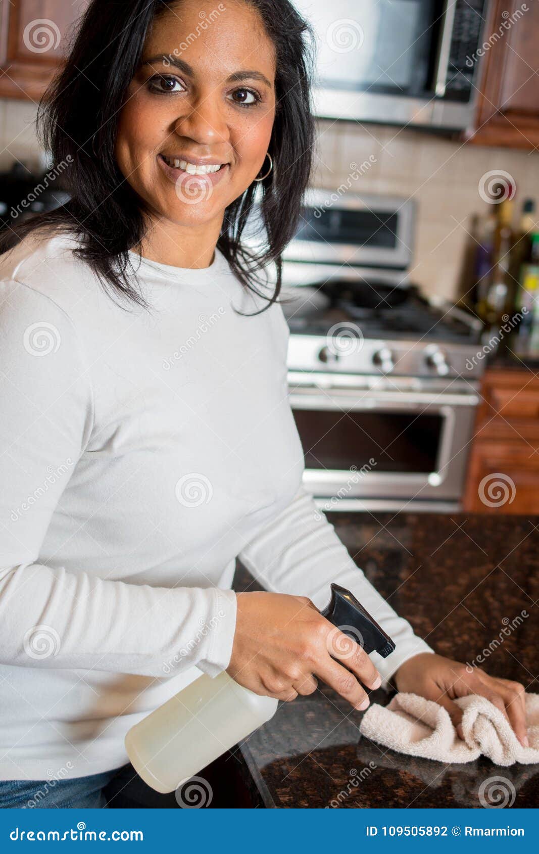 Woman Cleaning Kitchen stock photo. Image of maid, counter - 109505892