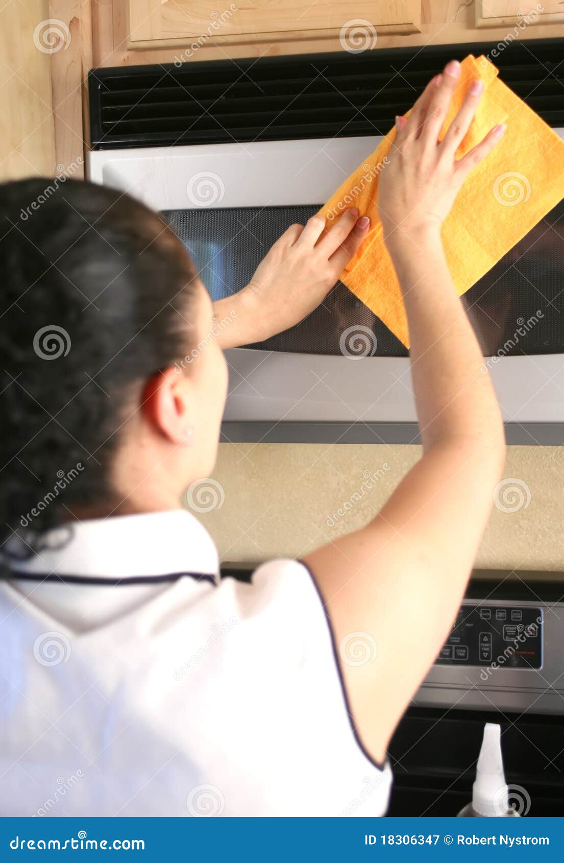 Woman cleaning microwave stock image. Image of hispanic - 18306347