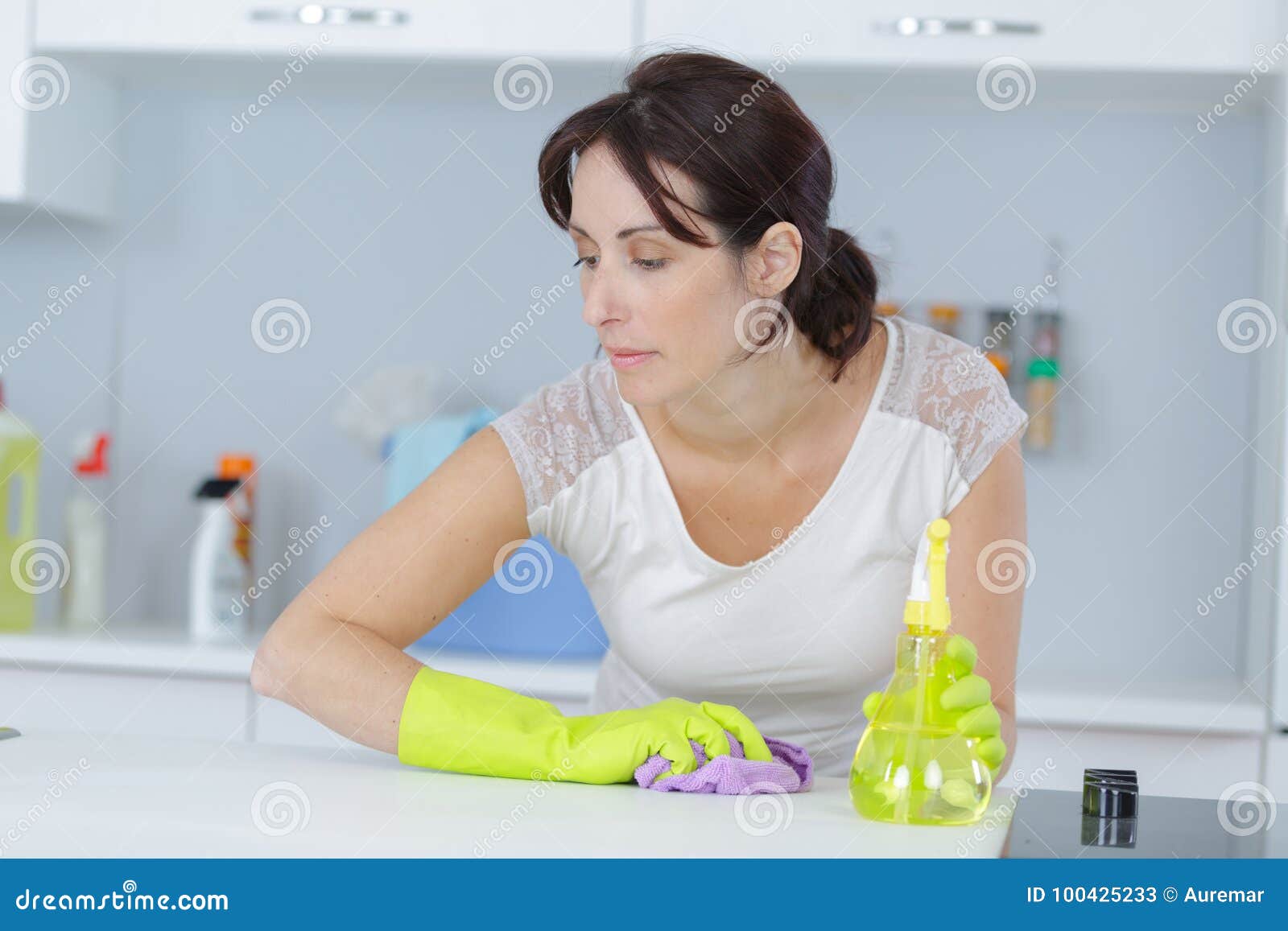 Woman cleaning table top stock image. Image of wife - 100425233