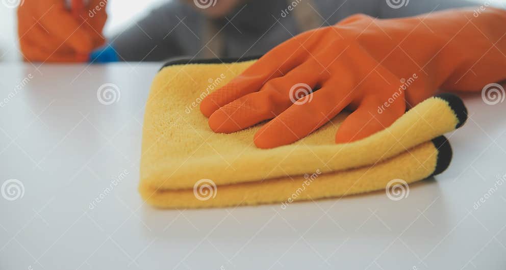 Woman Cleaning Table Using Rag and Diffuser at Home Stock Photo - Image ...