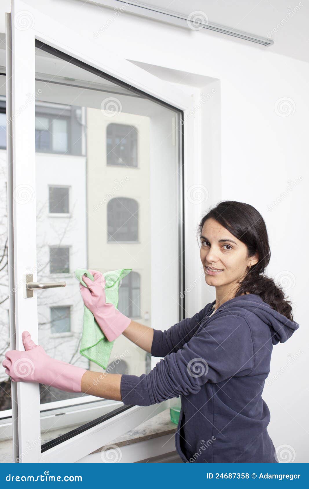 Woman cleaning a window stock photo. Image of latin, living - 24687358
