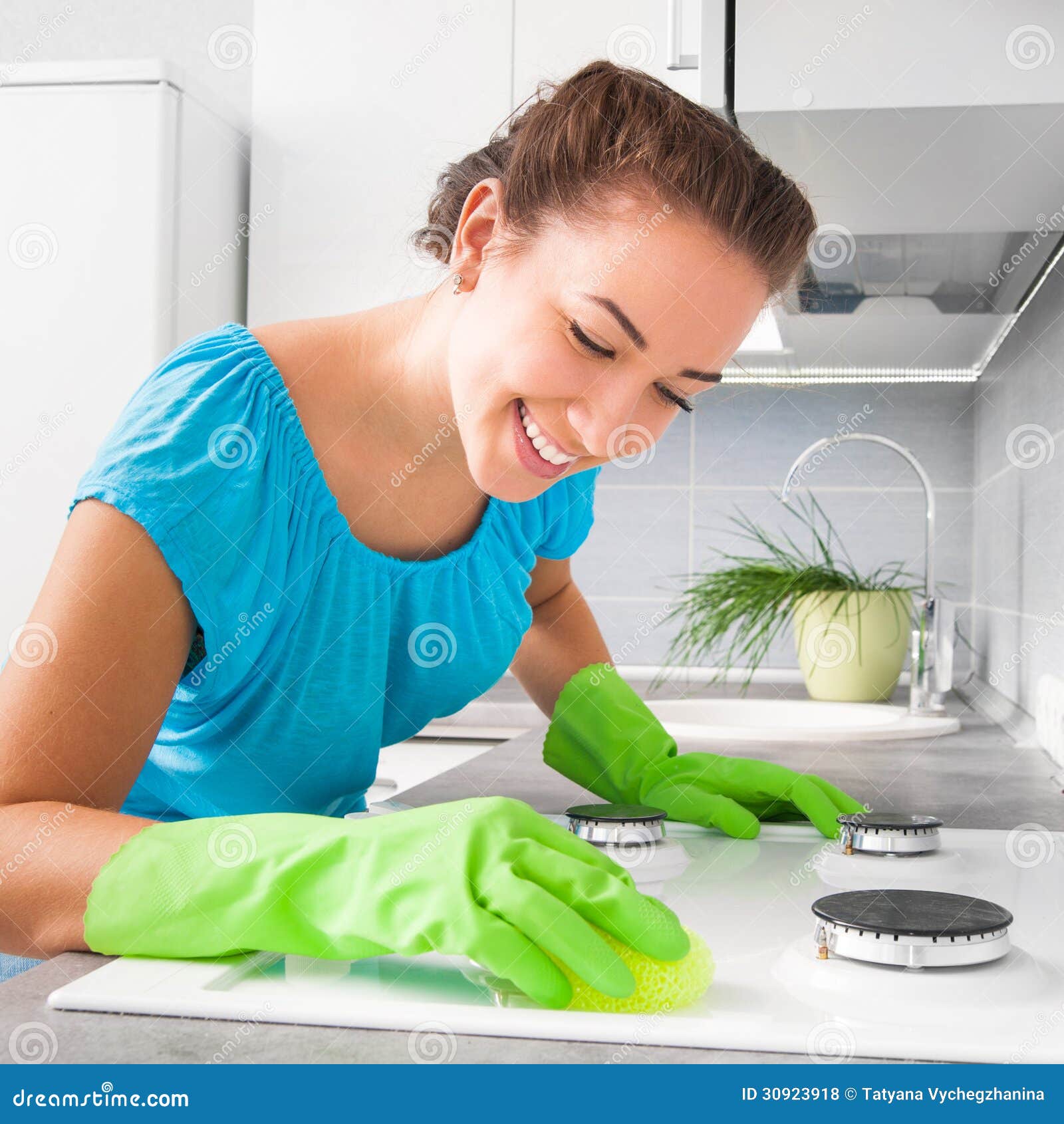 Woman cleans the kitchen stock photo. Image of beautiful - 30923918