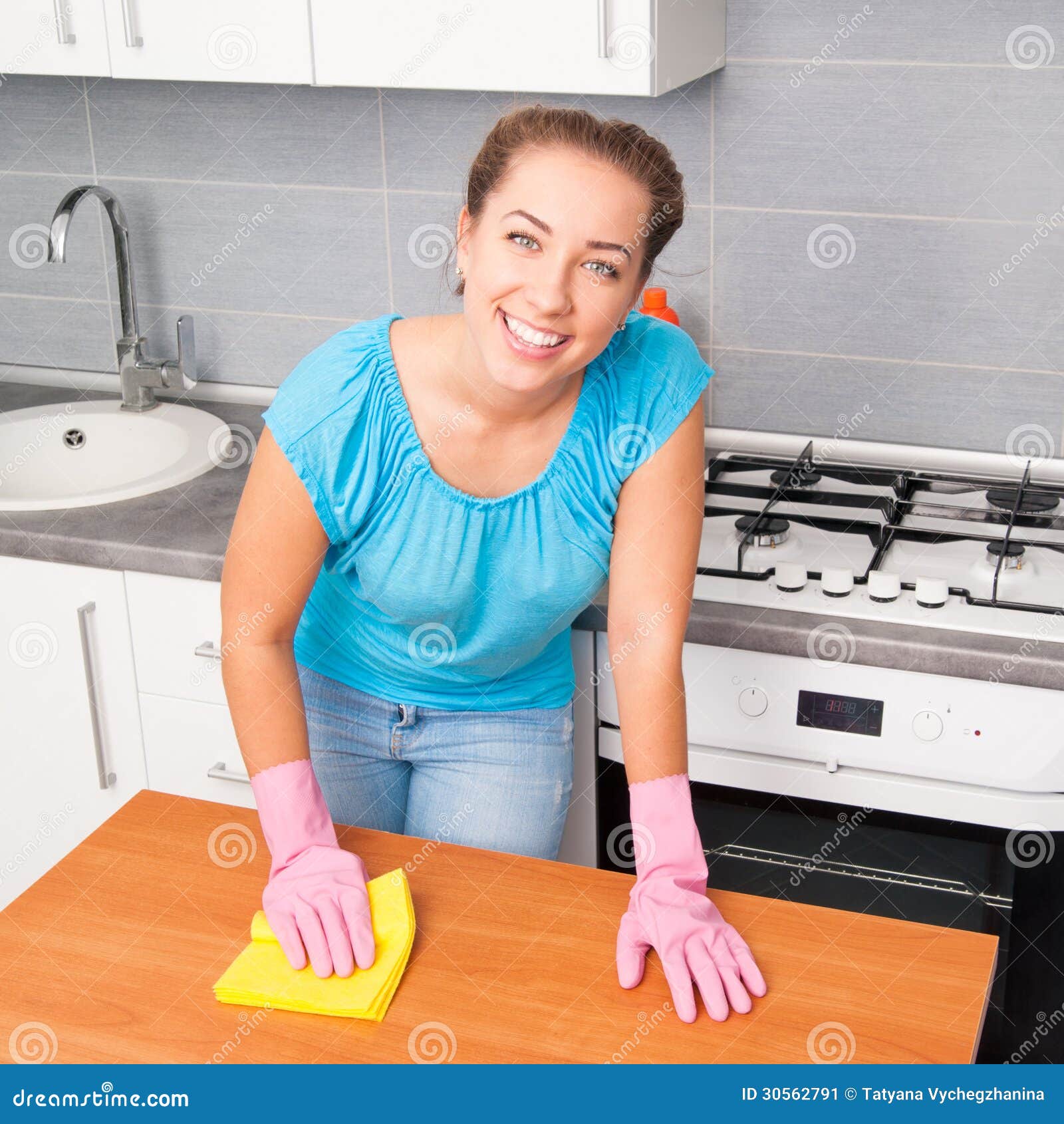Woman cleans the kitchen stock image. Image of hygiene - 30562791