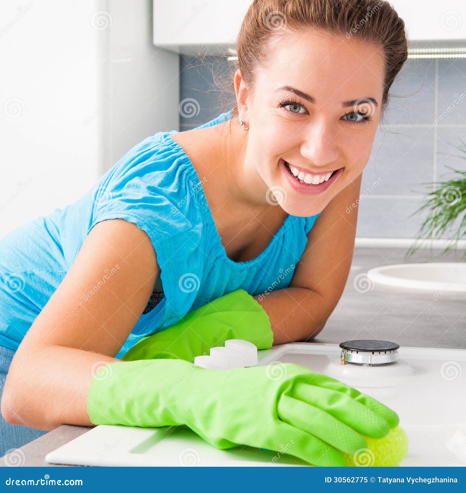 Woman cleans the kitchen stock image. Image of adult - 30562775