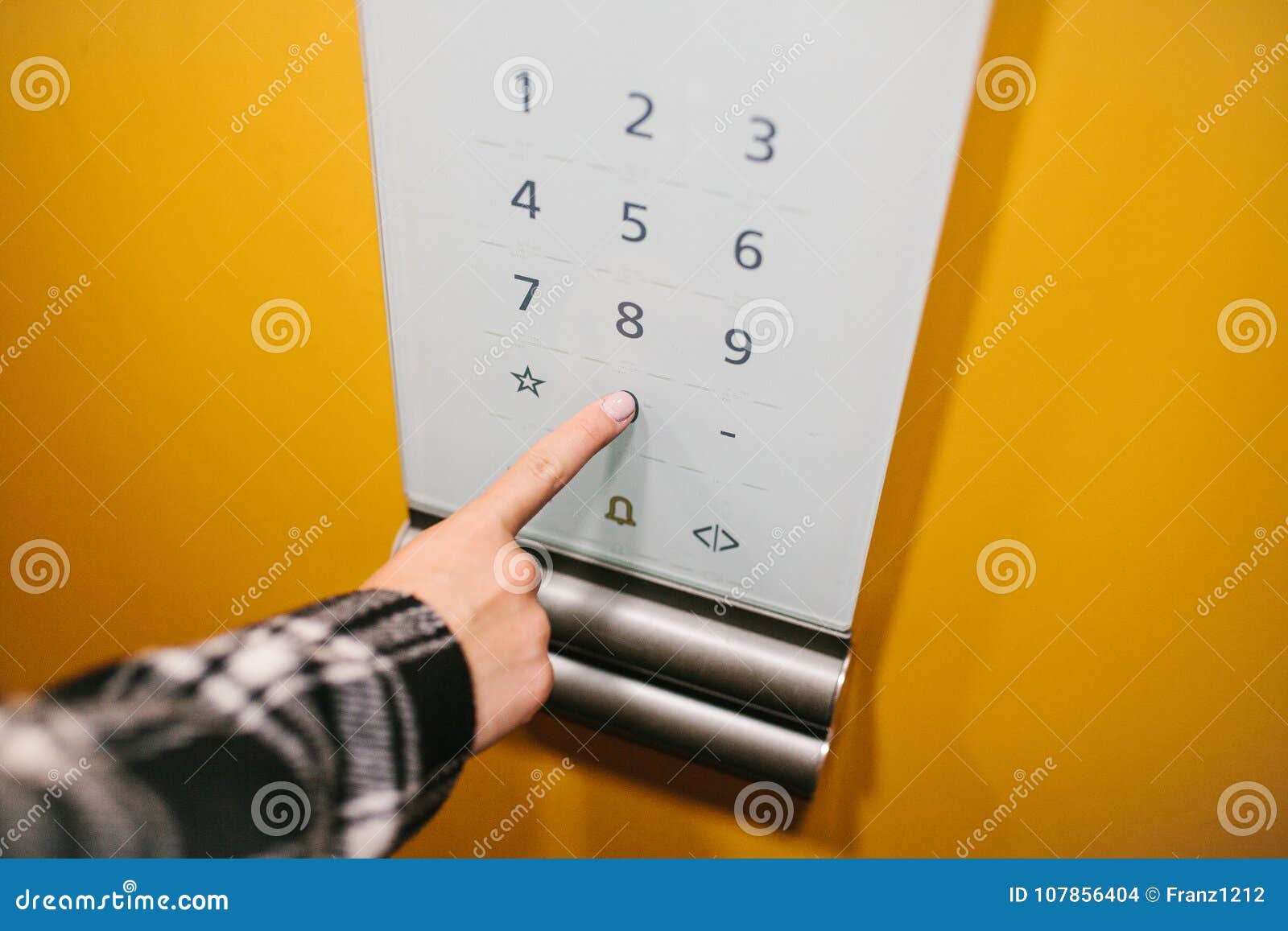 A Woman Clicks on an Electronic Button in a Modern Elevator. Inside the ...