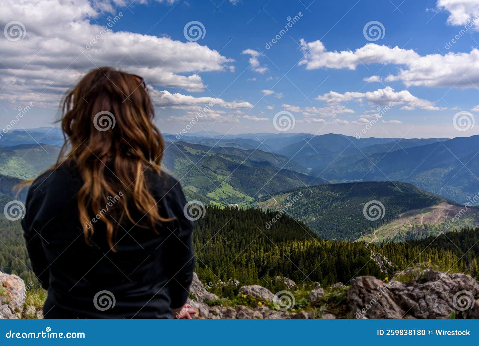 Woman on a Cliff Looking at the Mountain View Stock Photo - Image of ...