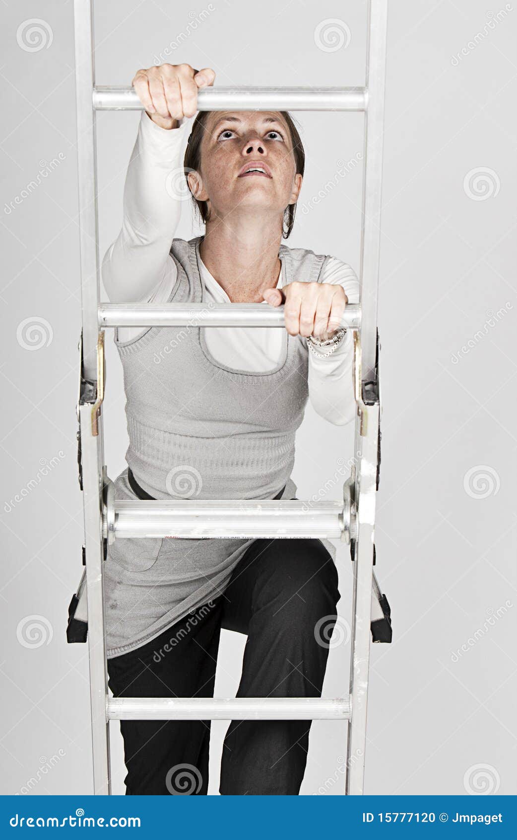 Woman Climbing a Ladder stock photo. Image of stepladder - 15777120