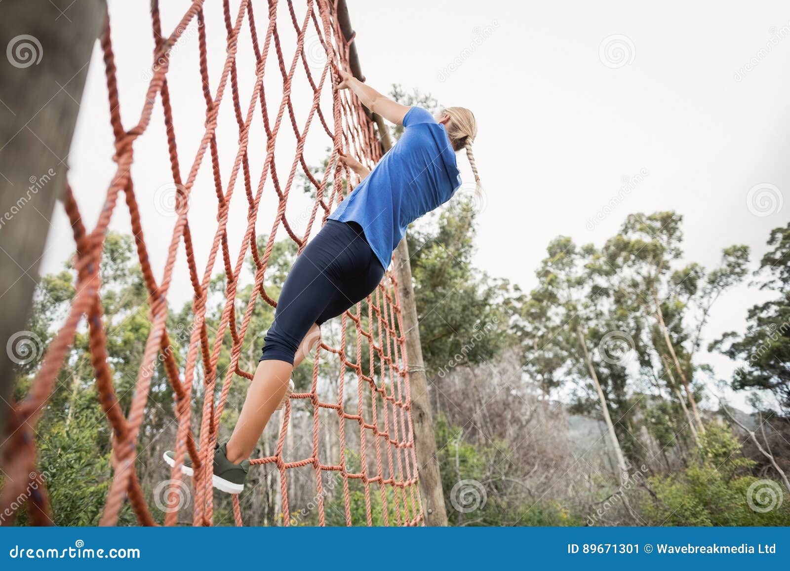Woman Climbing a Net during Obstacle Course Stock Image - Image of ...