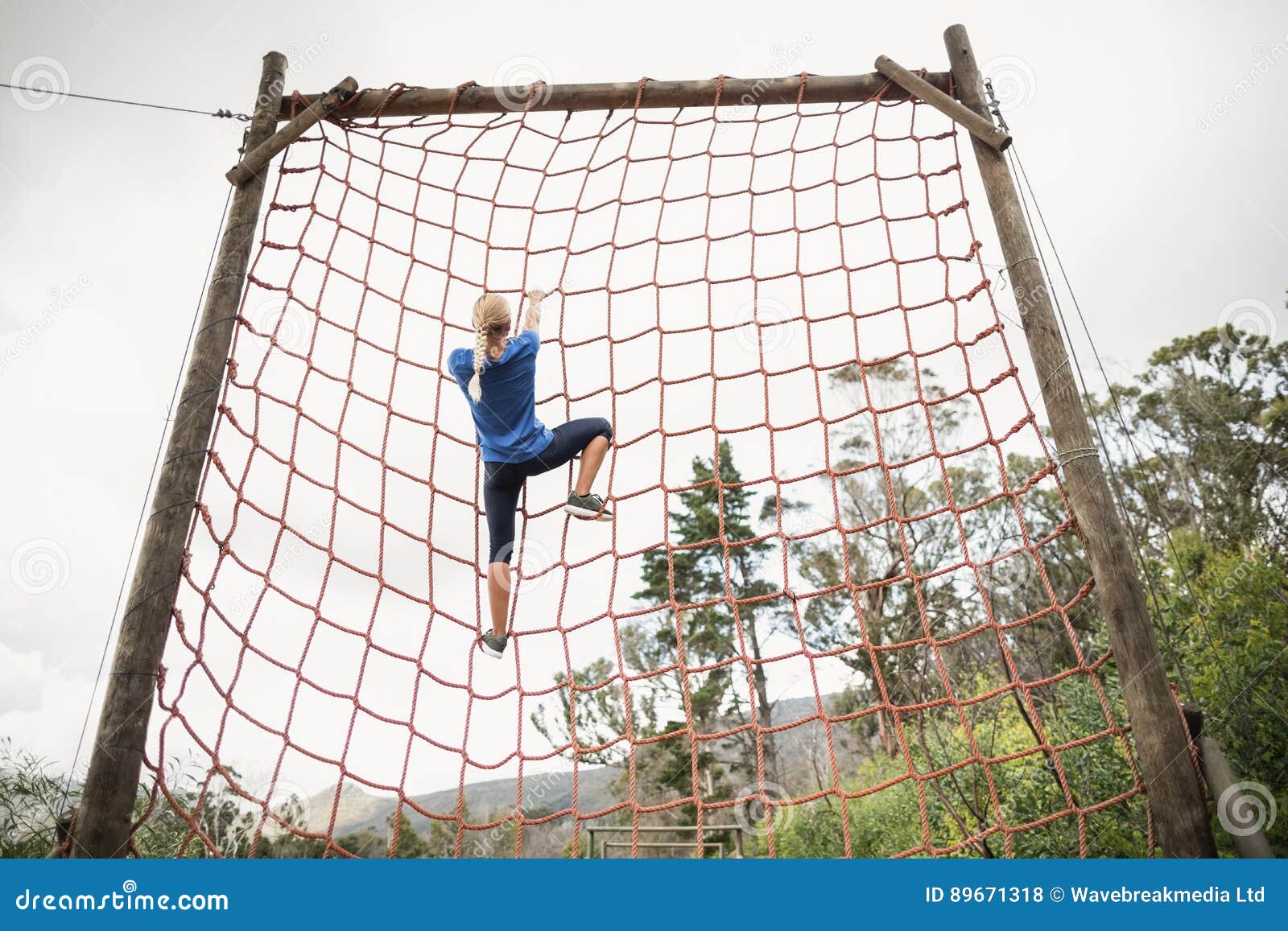 Woman Climbing a Net during Obstacle Course Stock Photo - Image of ...