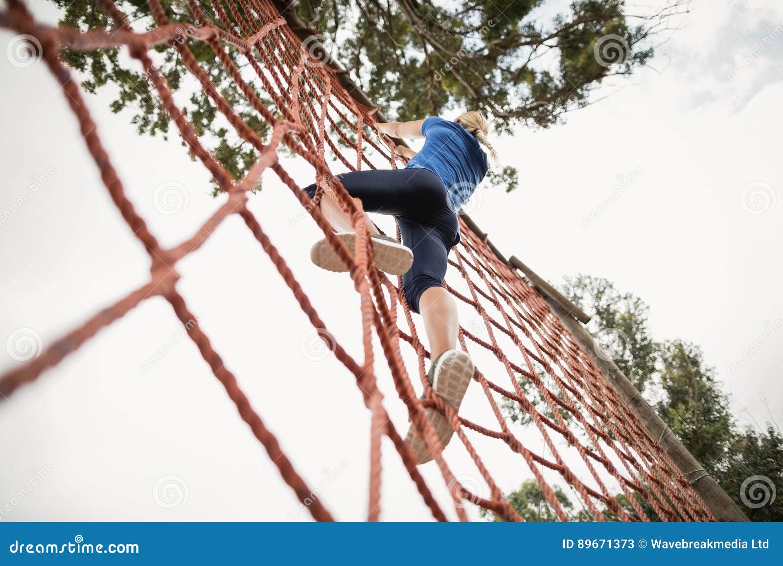 Woman Climbing a Net during Obstacle Course Stock Image - Image of park ...
