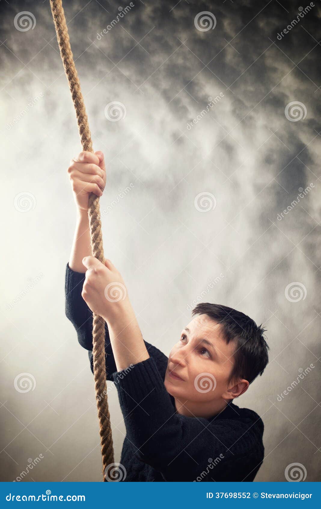 Woman Climbing Up with Rope Stock Photo - Image of effort, achievement ...