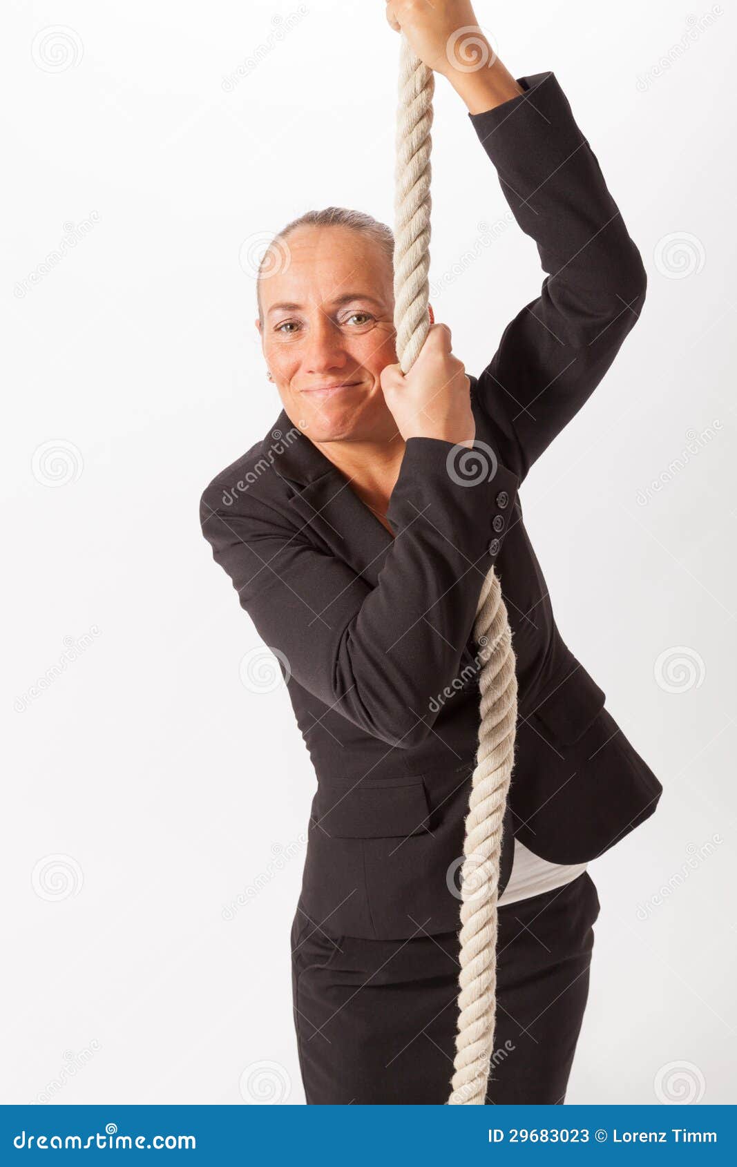 The Woman is Climbing Up a Thick Rope Stock Image - Image of white ...