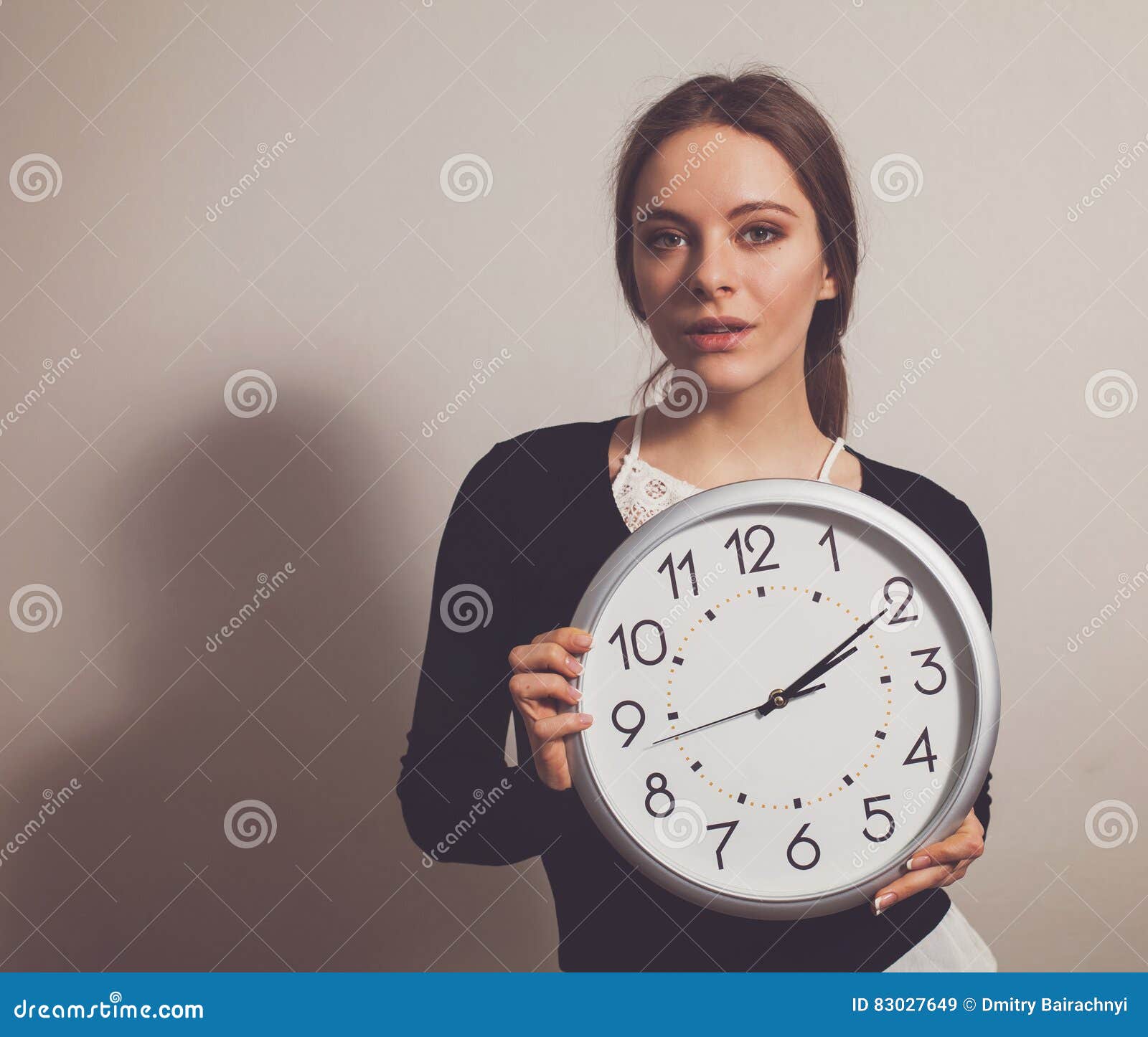 Woman with clock stock image. Image of woman, watch, holding - 83027649