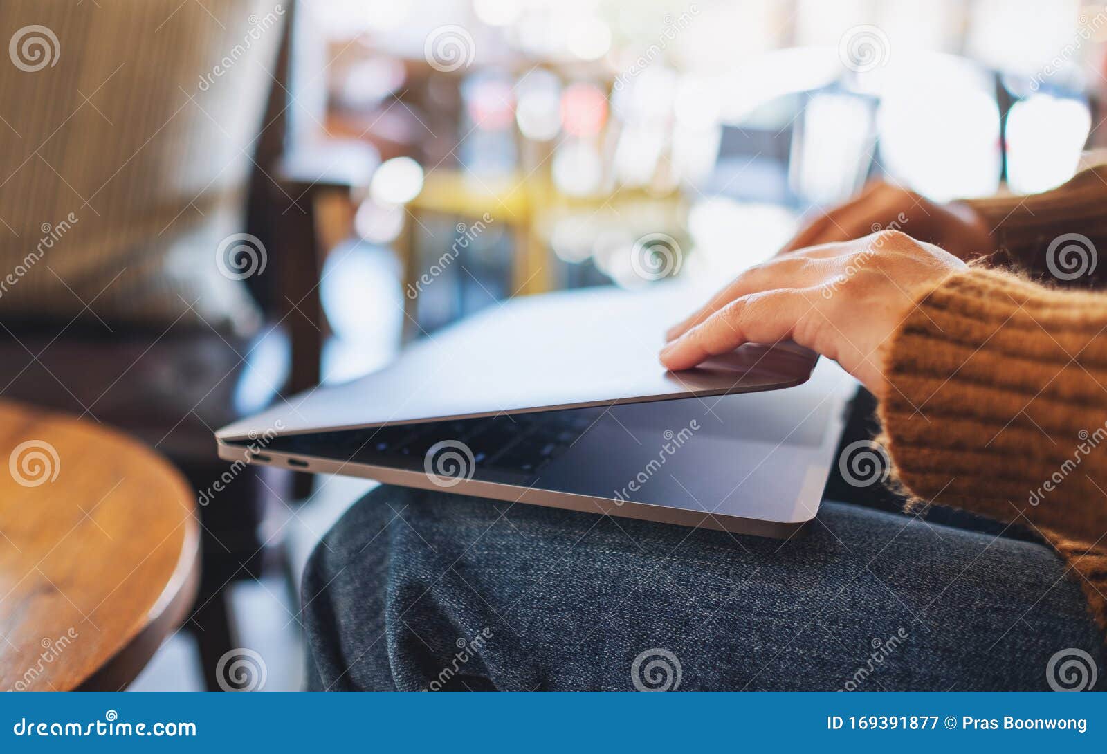 A Woman Close and Open a Laptop Computer after Finished Using it Stock ...