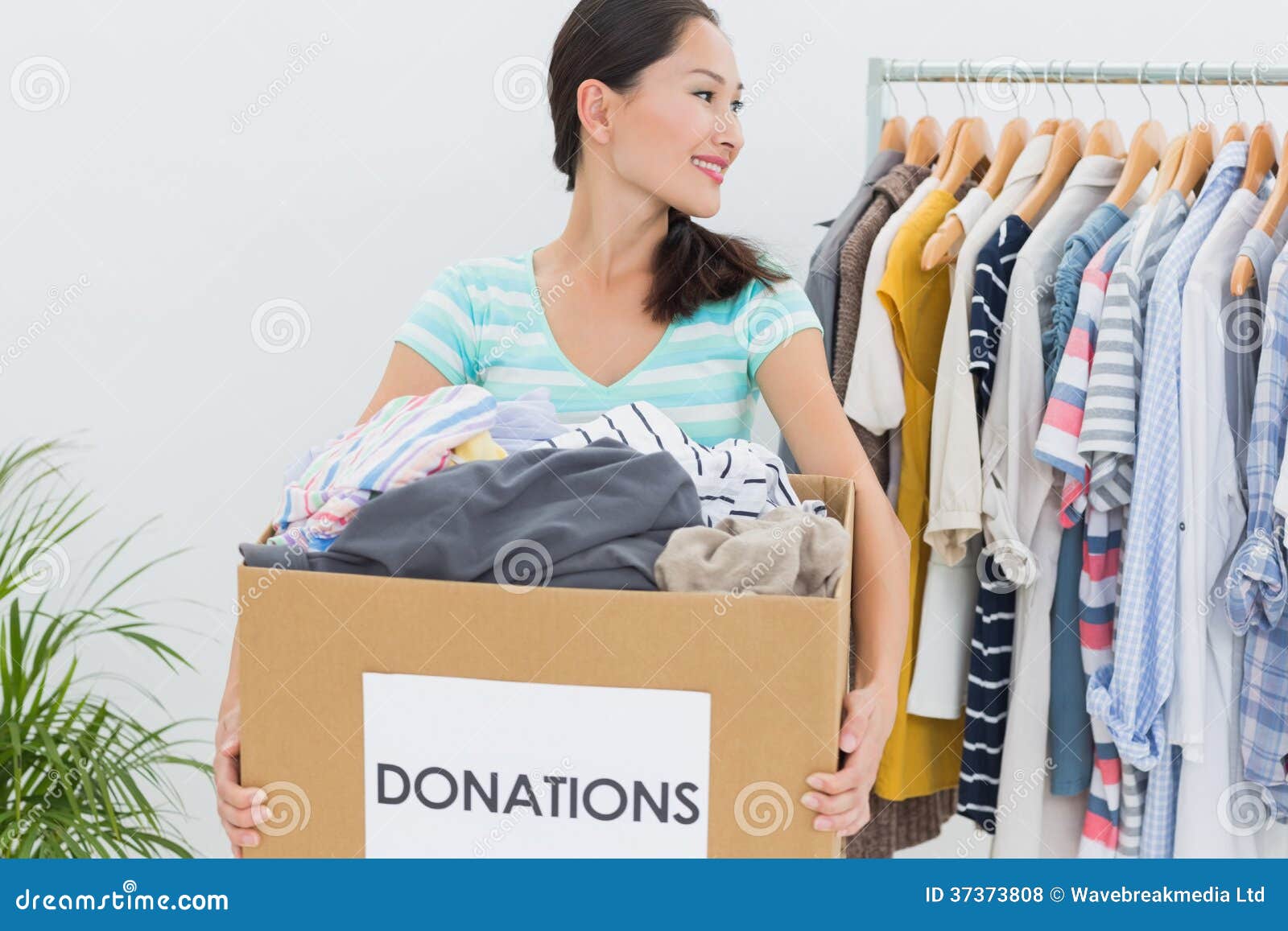 Woman with Clothes Donation Stock Photo - Image of looking, give: 37373808