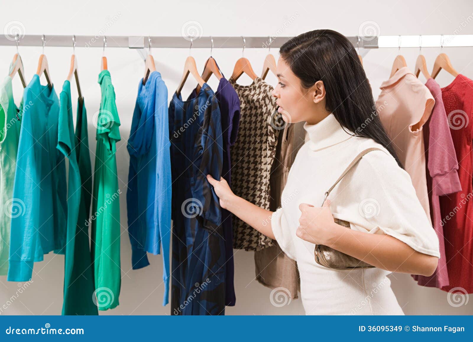 Woman in clothes shop stock image. Image of coathanger - 36095349
