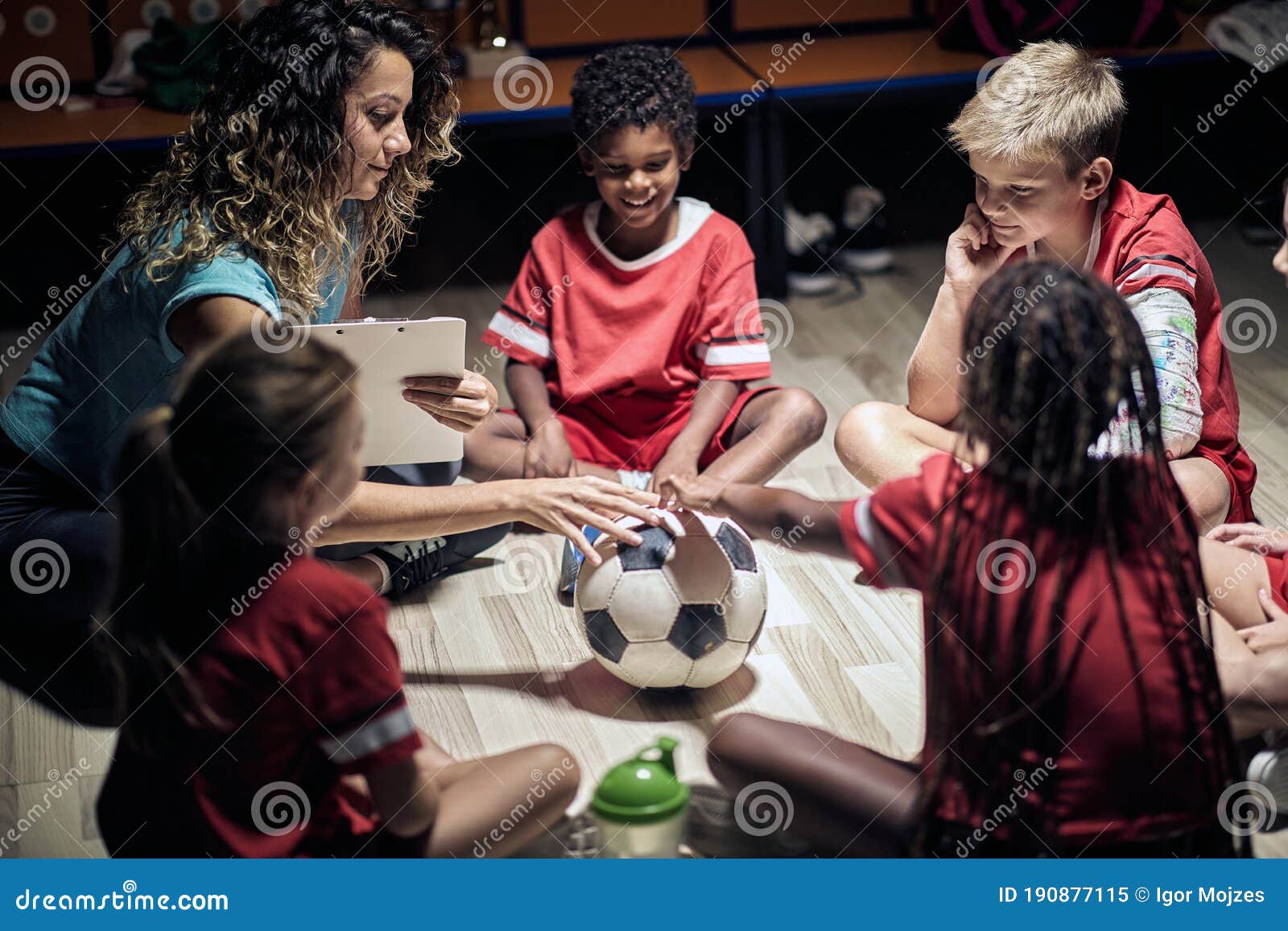 Woman Coach in Circle in Locker Room with Her Soccer Sport Team Stock ... Woman Coach in Circle in Locker Room with Her Soccer Sport Team Stock ...