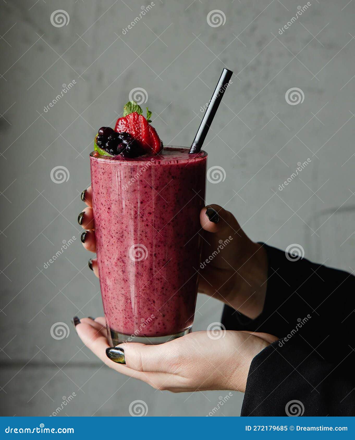 Woman In Cocktail Bar Holds Fresh Healthy Strawberry Smoothie With