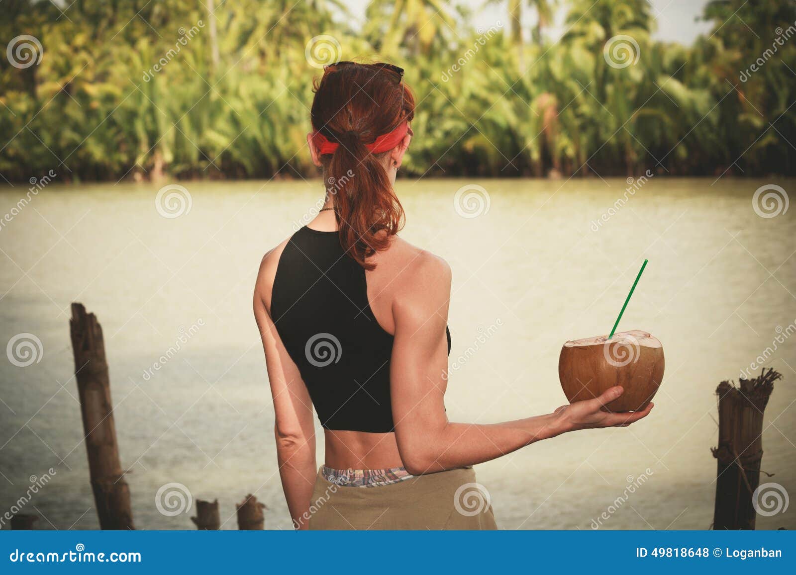 Woman with Coconut by a River Stock Photo - Image of plant, tropical ...