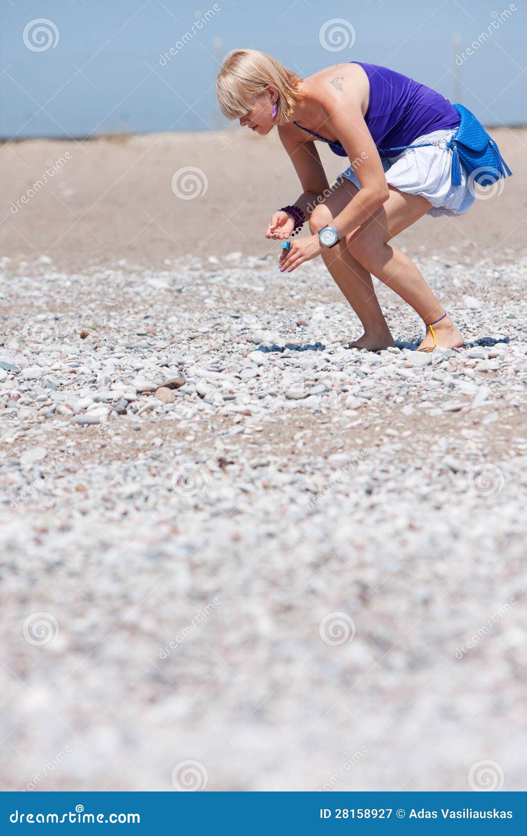 Woman collecting shells stock image. Image of sand, collecting - 28158927