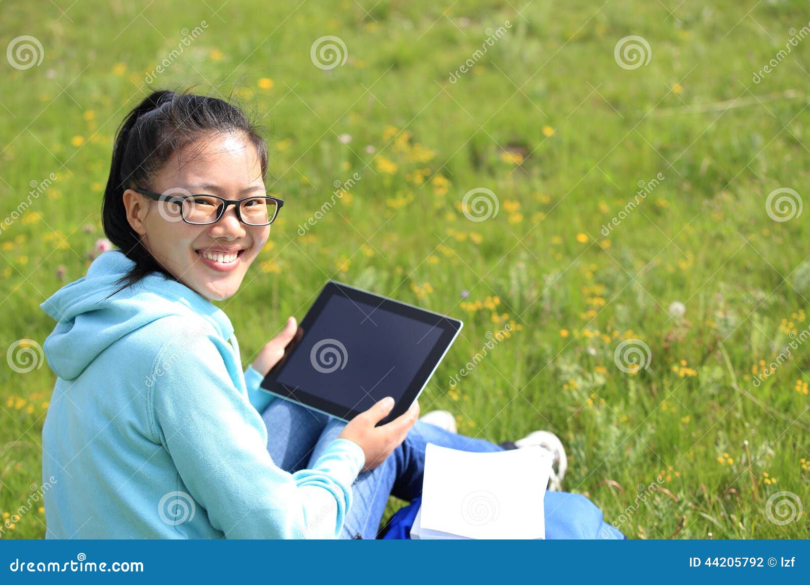 Woman College Student Use Tablet Pc Sit on Grass Stock Photo - Image of ...