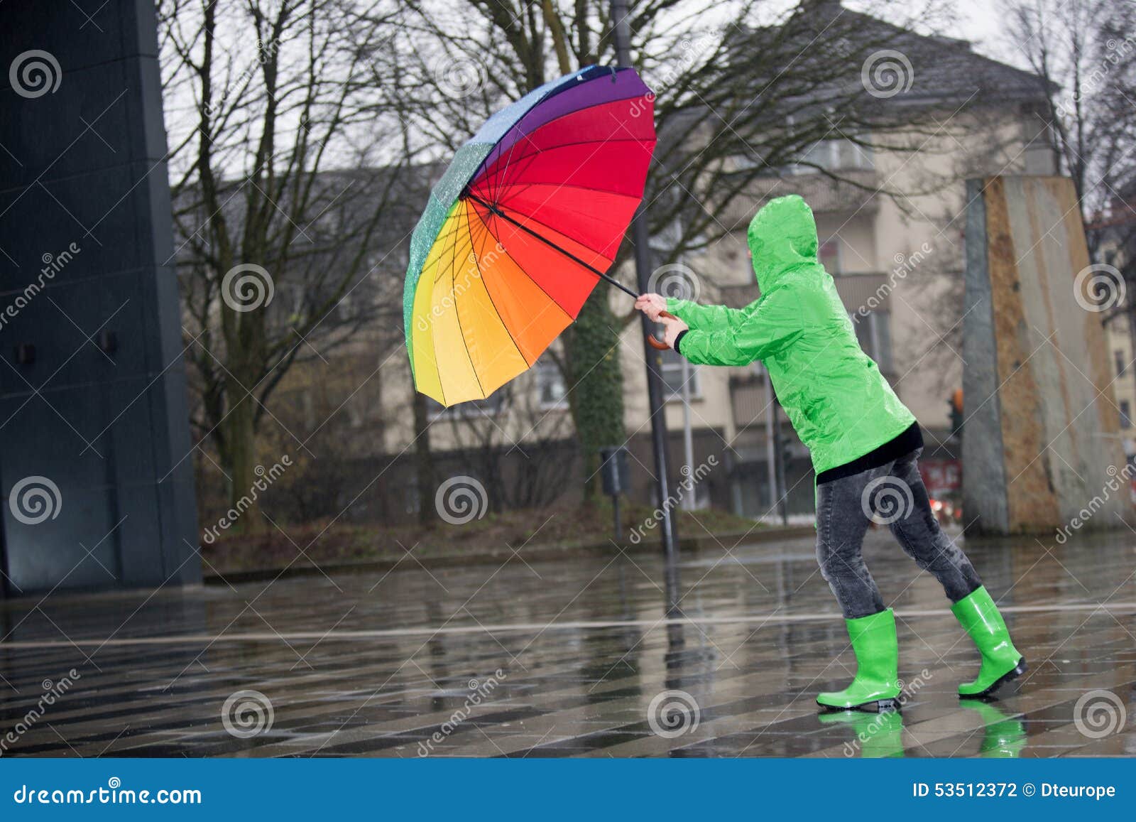 Woman with a Colored Umbrella Fights Against a Storm Stock Photo ...