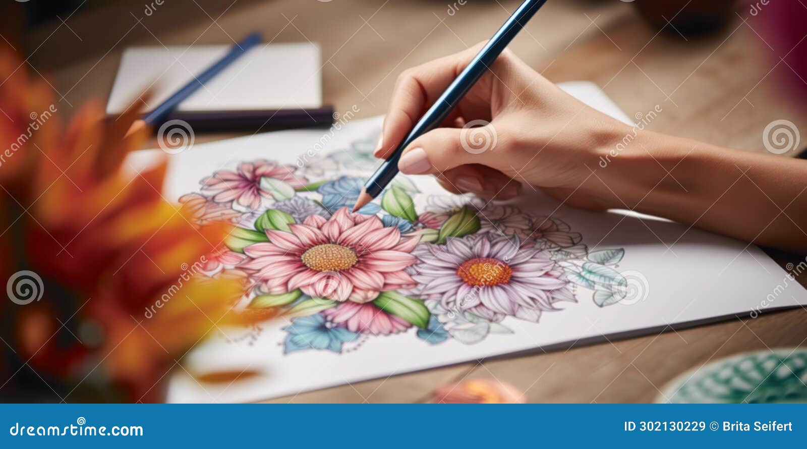 A Woman Coloring a Coloring Page with Colored Pencils Stock Image ...
