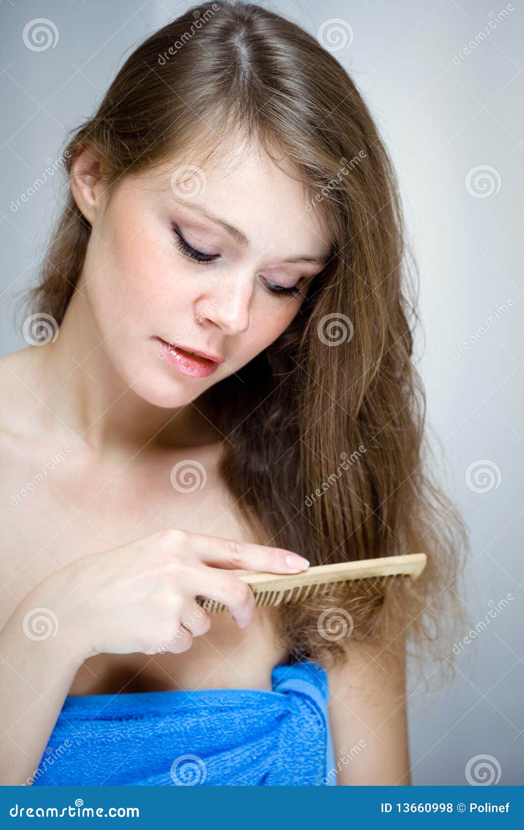 Woman combing her hair stock photo. Image of preparation - 13660998