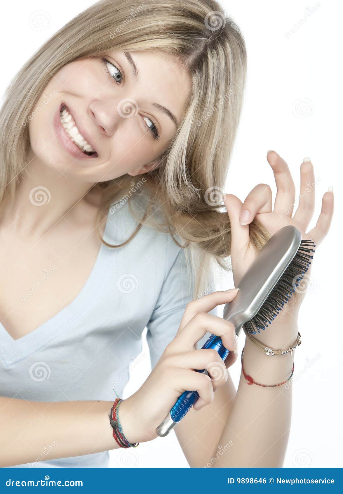 Woman combing her hair stock photo. Image of attractive - 9898646