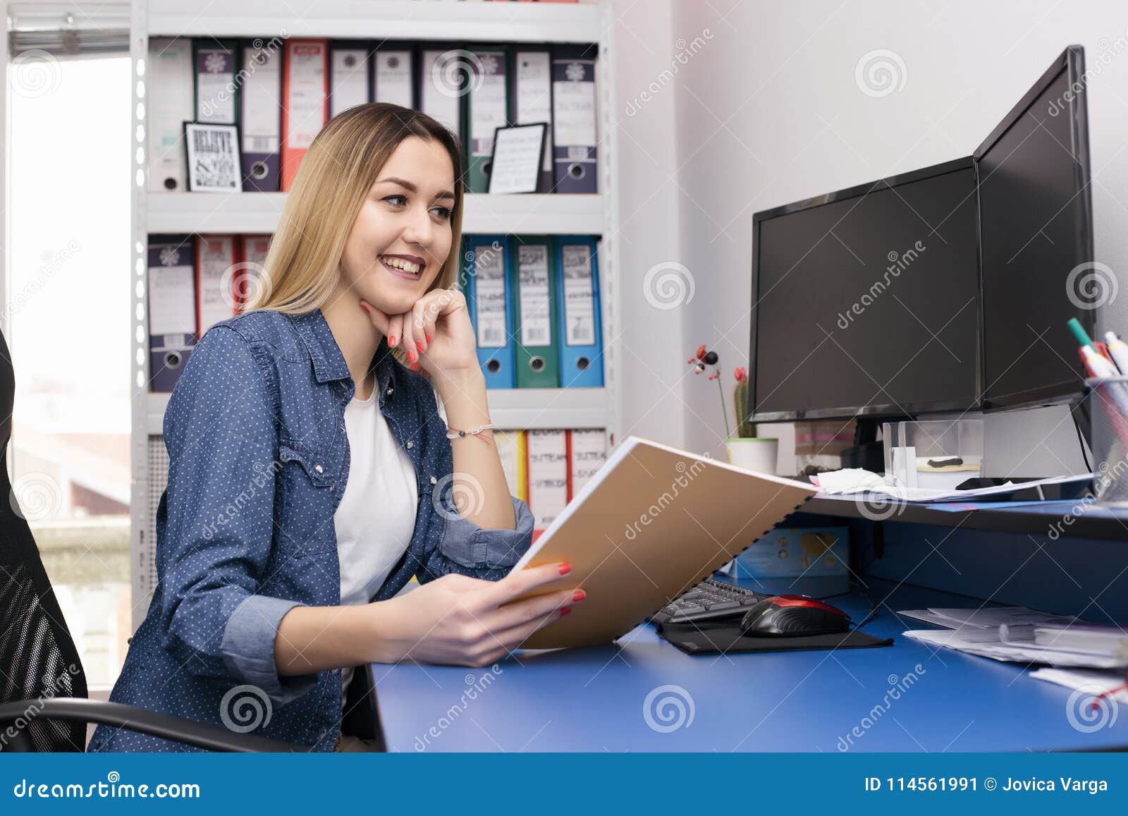 Woman Comparing Documents with a Computer Stock Image - Image of ...