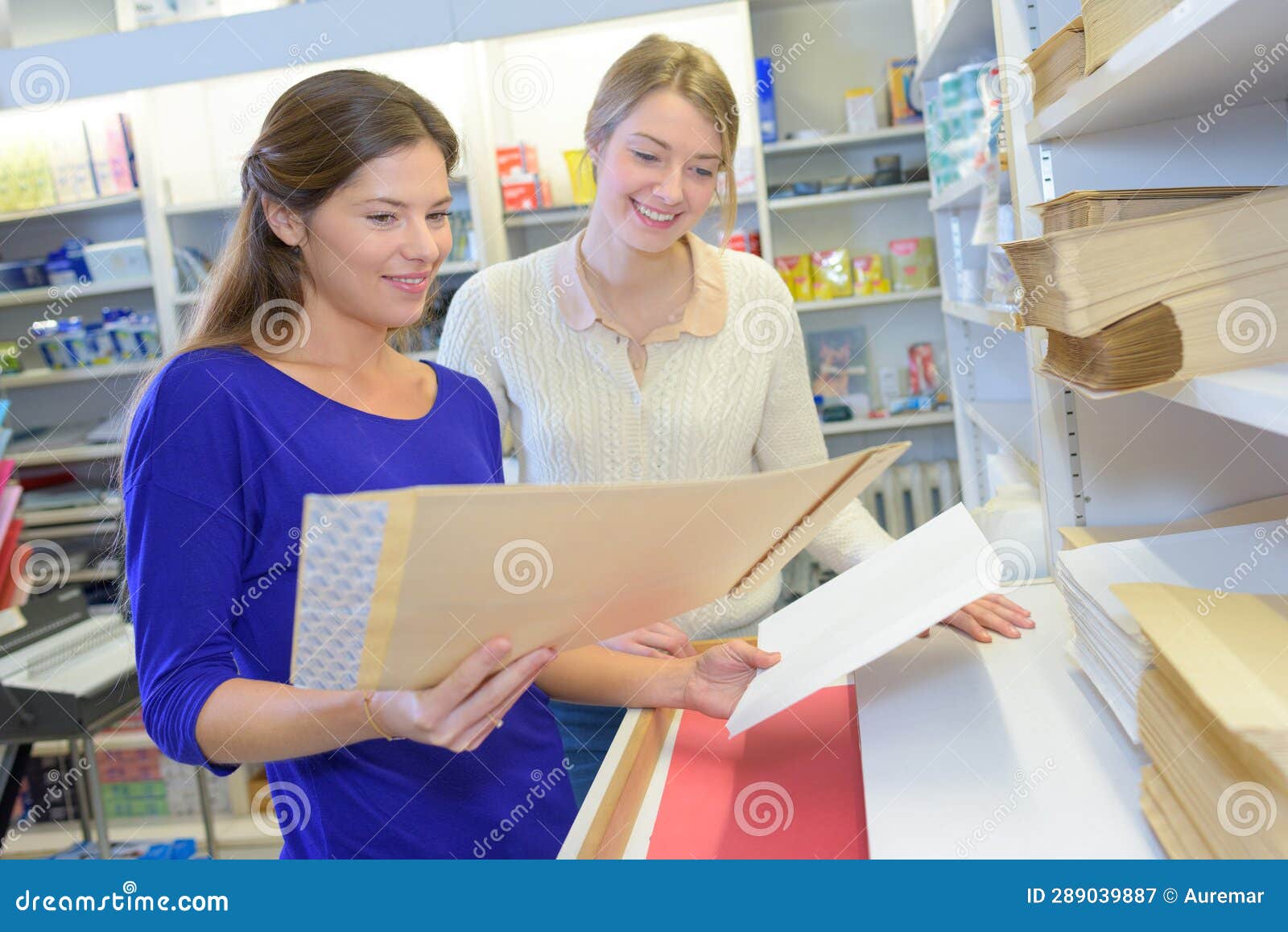 Woman Comparing Envelopes in Store Stock Image - Image of customer ...