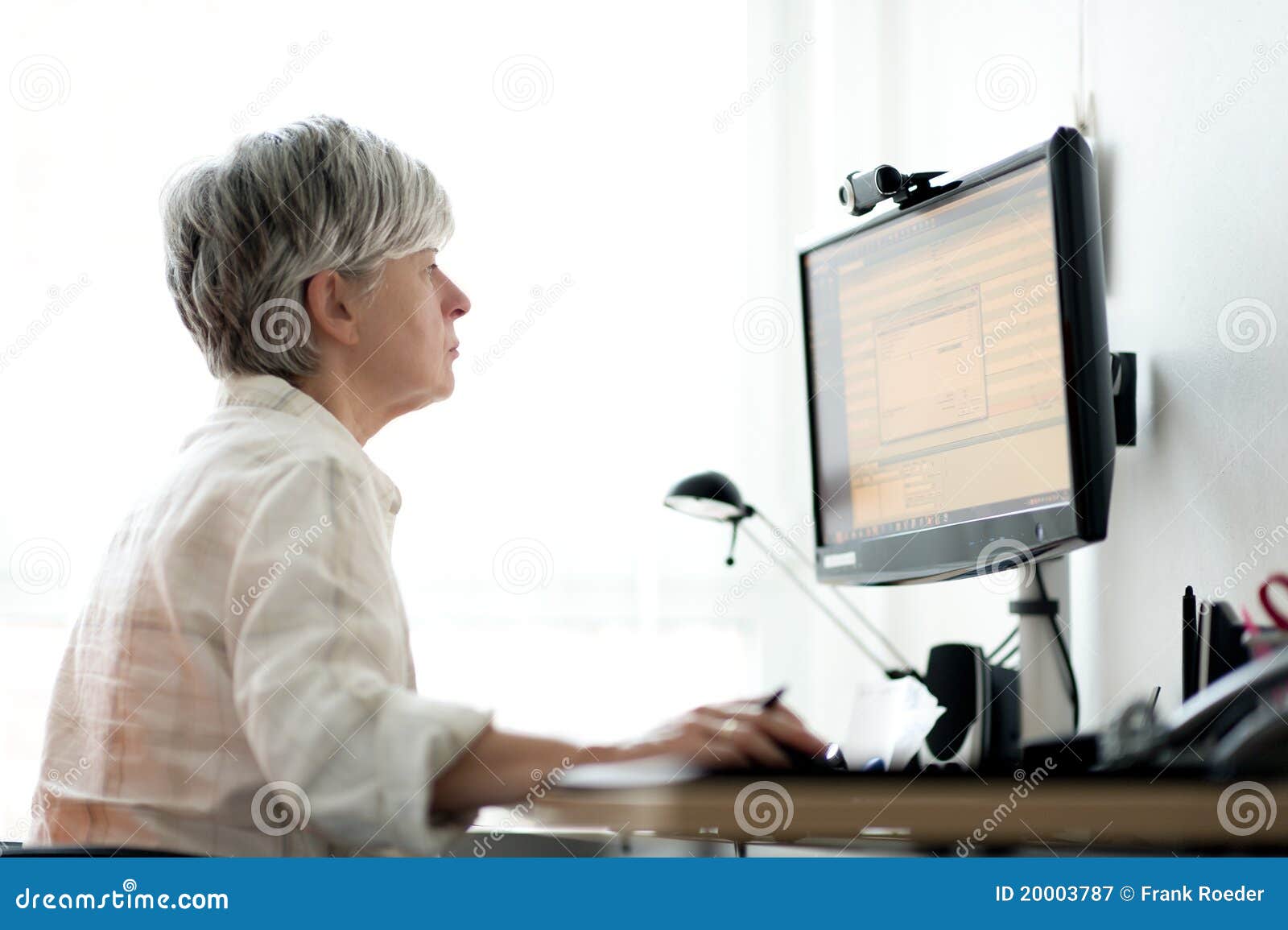 Woman at computer stock image. Image of raised, indoors - 20003787