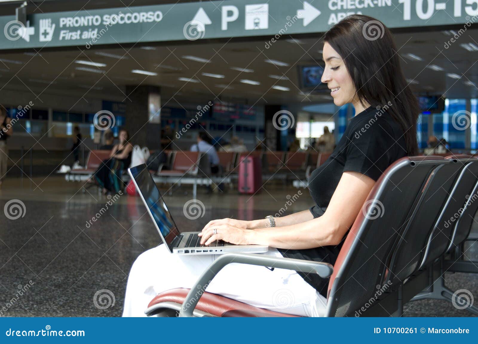 Woman on Computer in Airport Stock Image - Image of lunch, break: 10700261