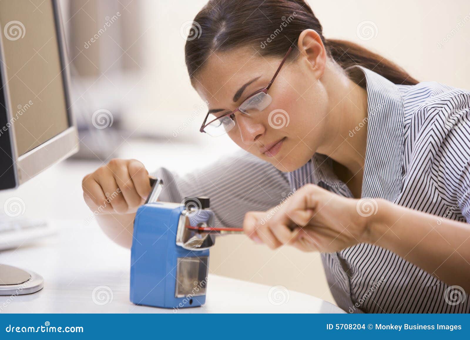 Woman in Computer Room Using Pencil Sharpener Stock Photo - Image of ...