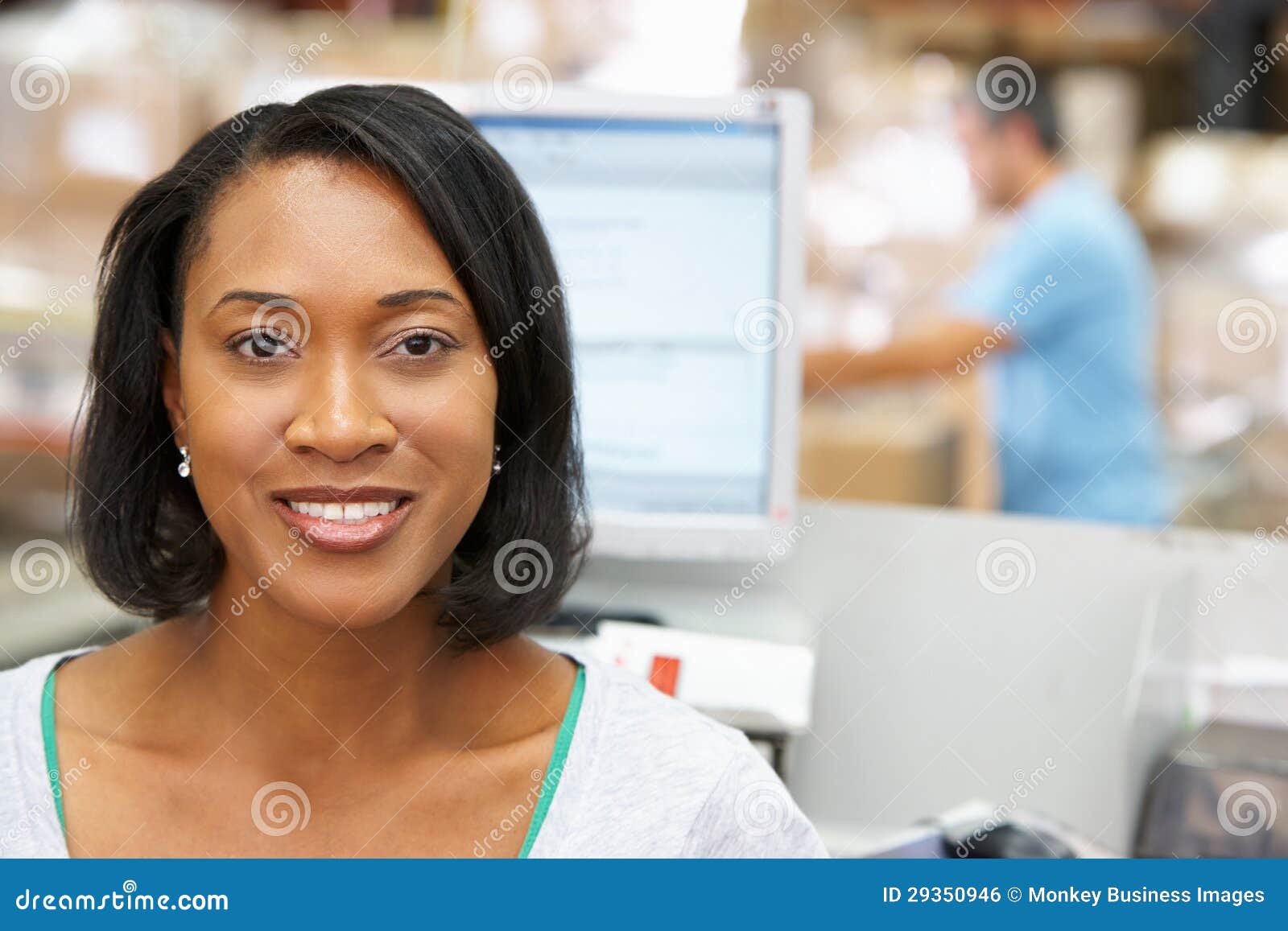 Woman at Computer Terminal in Distribution Warehouse Stock Photo ...