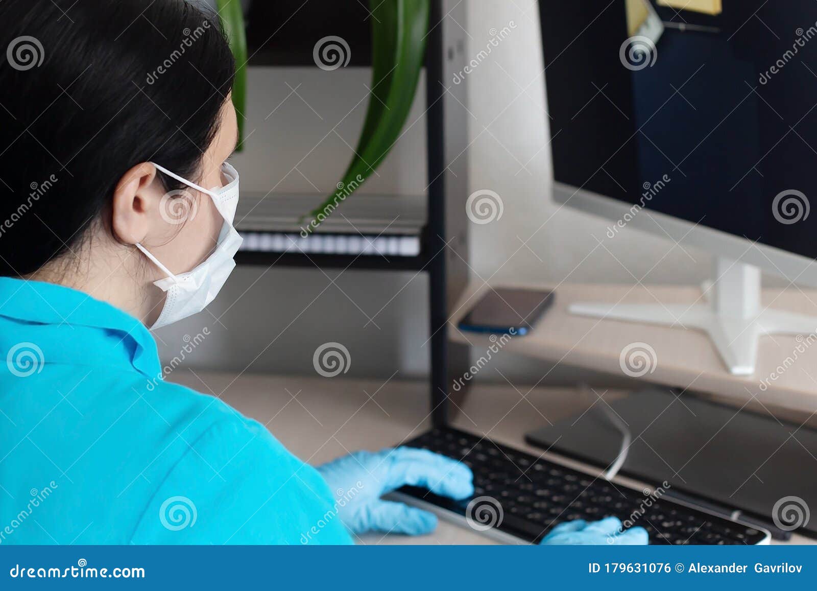 Woman at the Computer Wearing a Protective Mask and Gloves Stock Photo ...