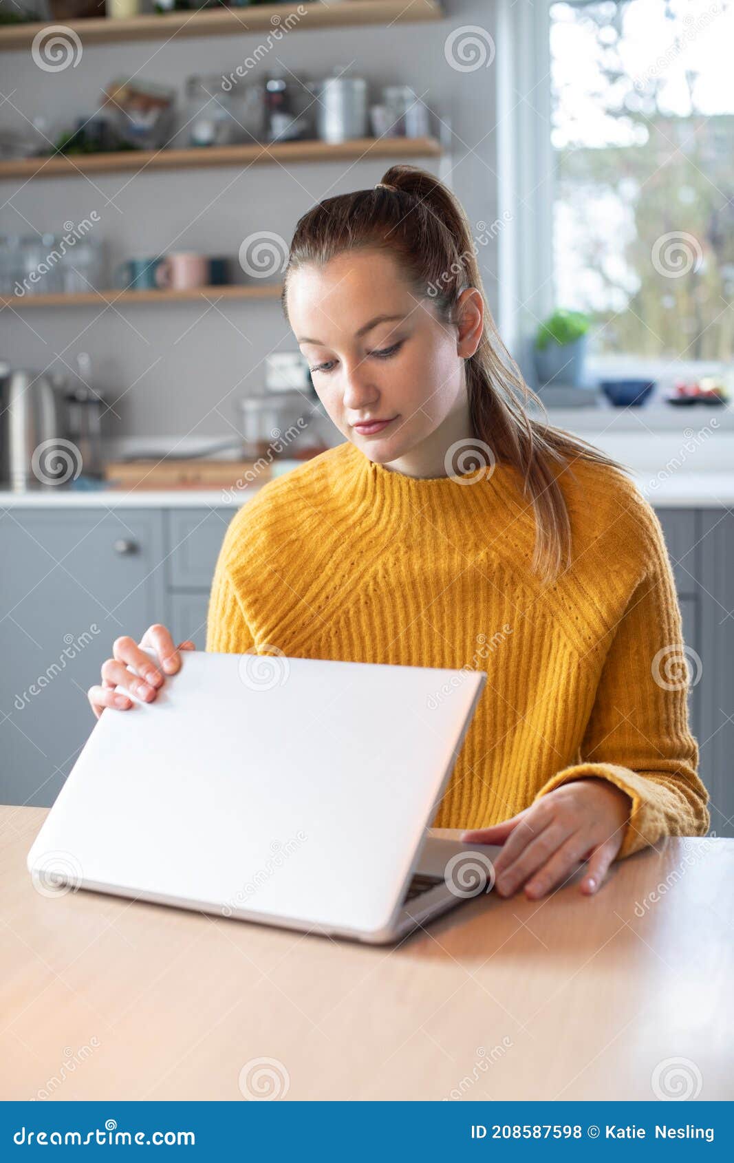 Woman Concerned about Excessive Use of Internet Closing Lid of Laptop ...
