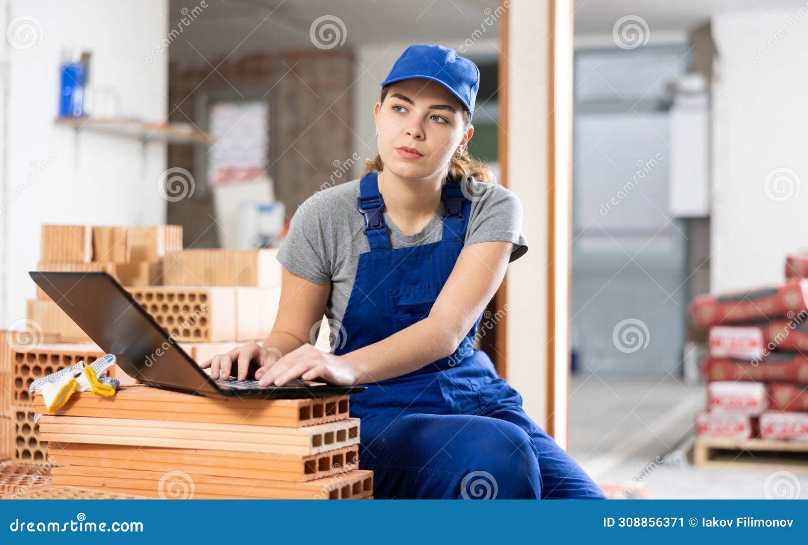 Woman Construction Worker Using Laptop in Apartment Stock Image - Image ...