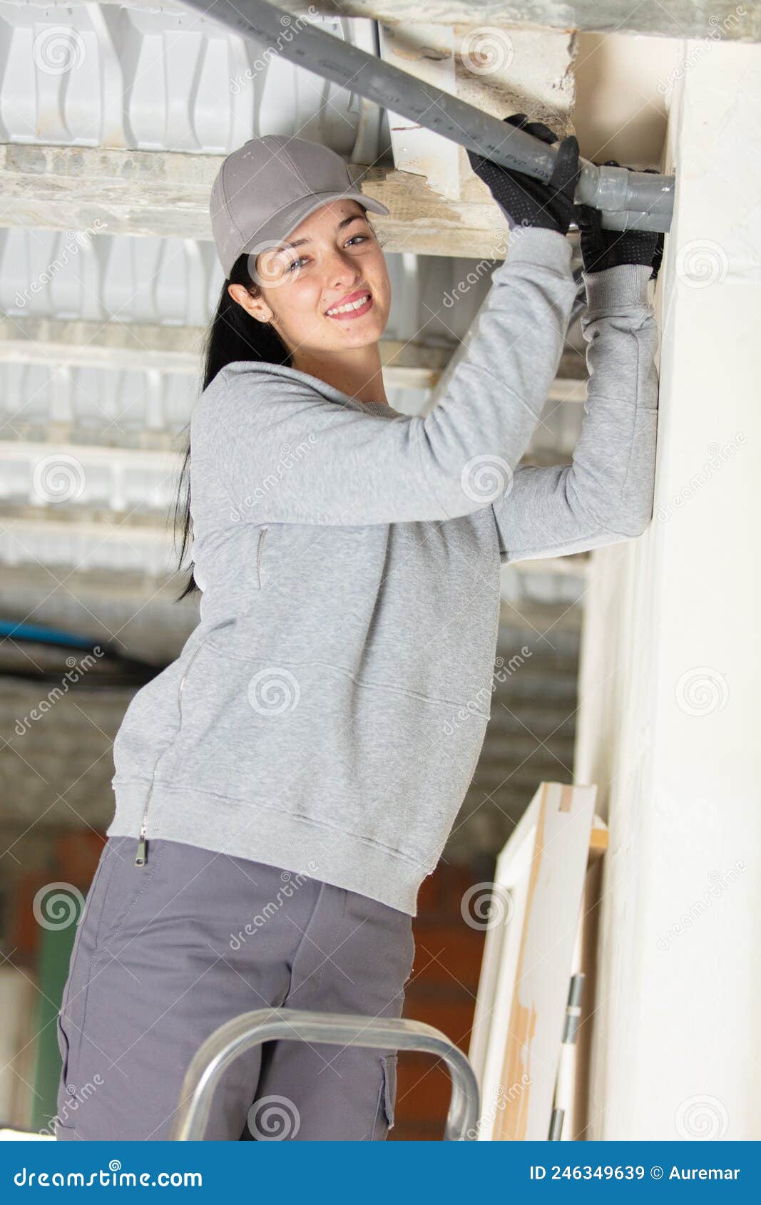 Woman Construction Worker Working on Ladder Stock Image - Image of ...
