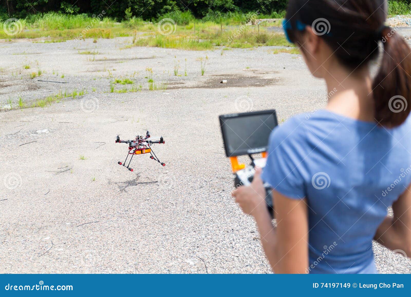 Woman controling the drone stock image. Image of filming - 74197149