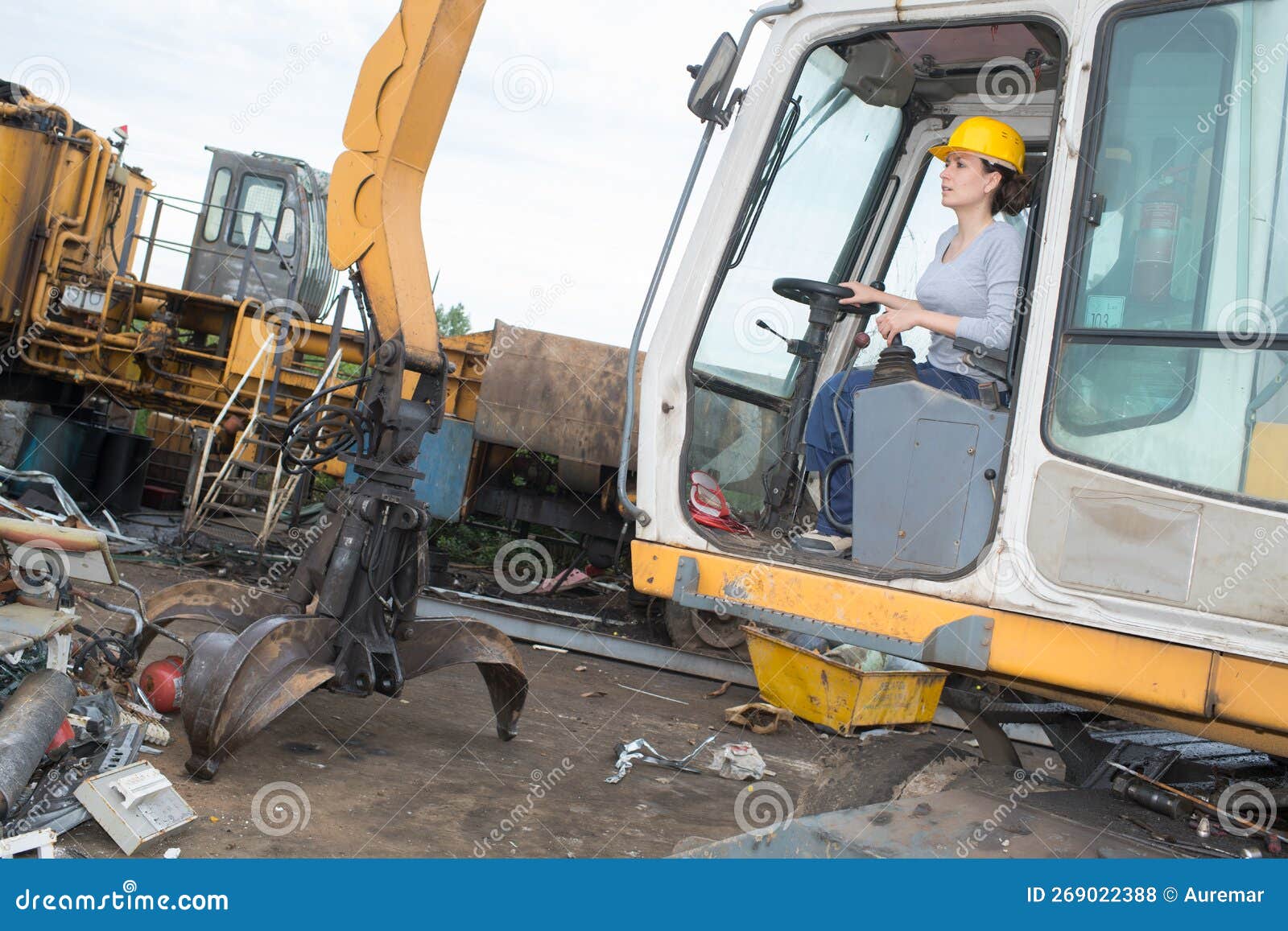 Woman Controlling Digger with Grab Attachment Stock Photo - Image of ...