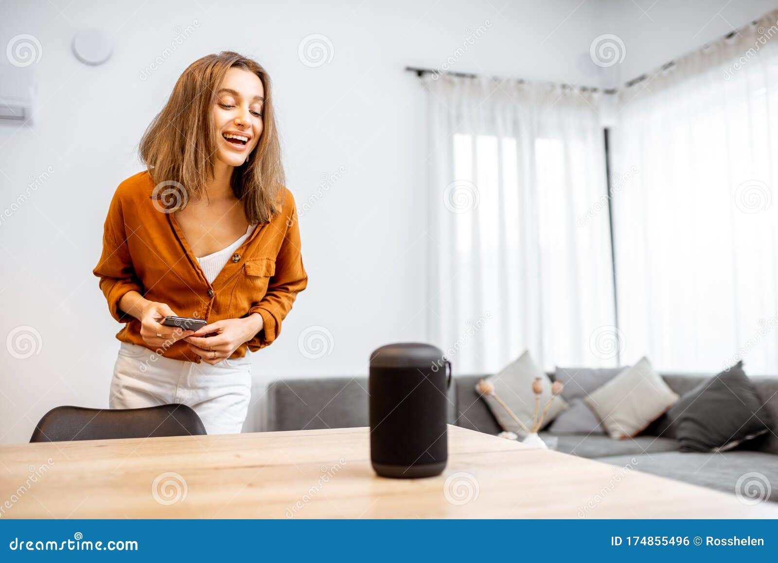 Woman Controlling Home Devices with a Voice Commands Stock Photo ...