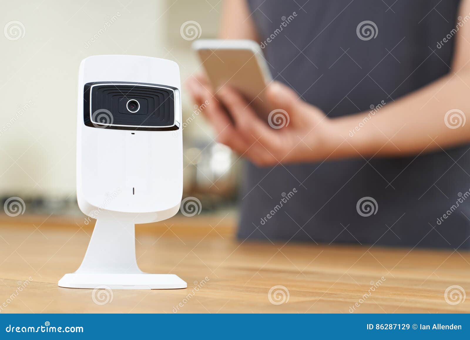 Woman Controlling Smart Security Camera Using App on Mobile Phone Stock ...