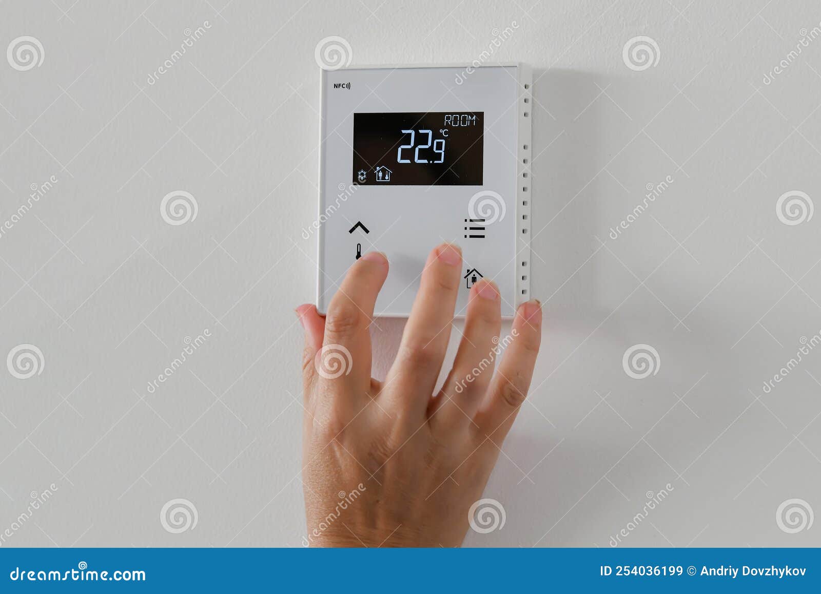 The Woman Controls the Temperature in the House. Air Conditioning and ...