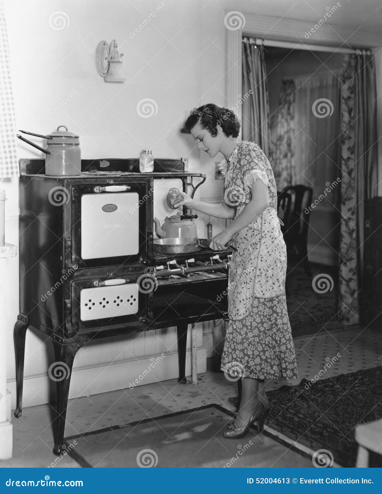 Woman Cooking on Antique Stove Stock Image - Image of busy, apron: 52004613