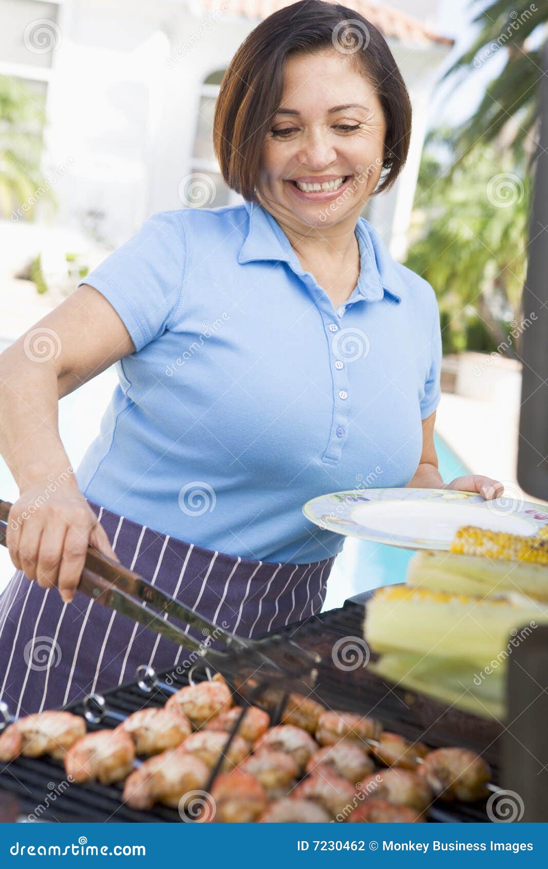 Woman Cooking on a Barbeque Stock Photo - Image of apron, food: 7230462